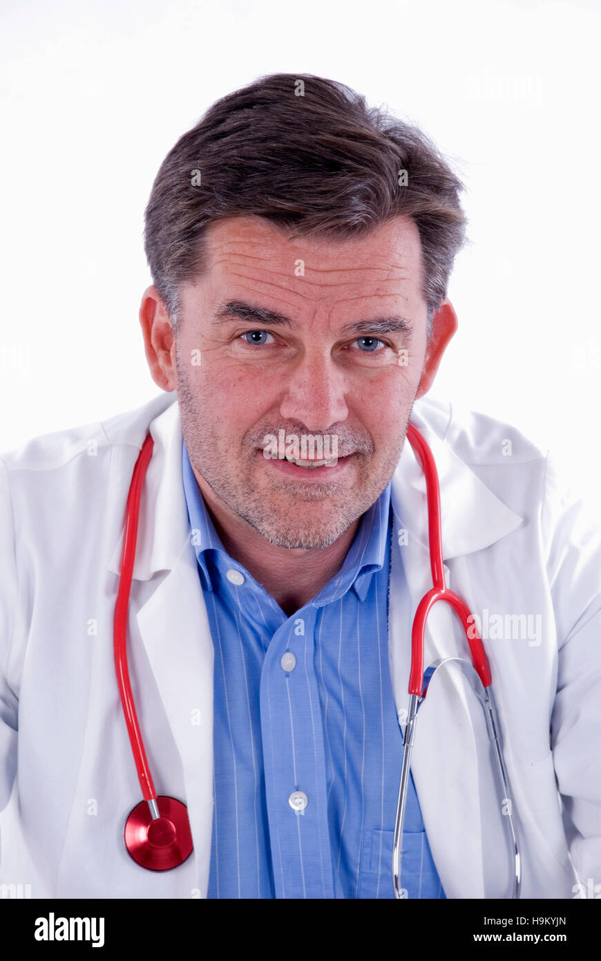 Doctor looks camera smiles hi-res stock photography and images - Alamy