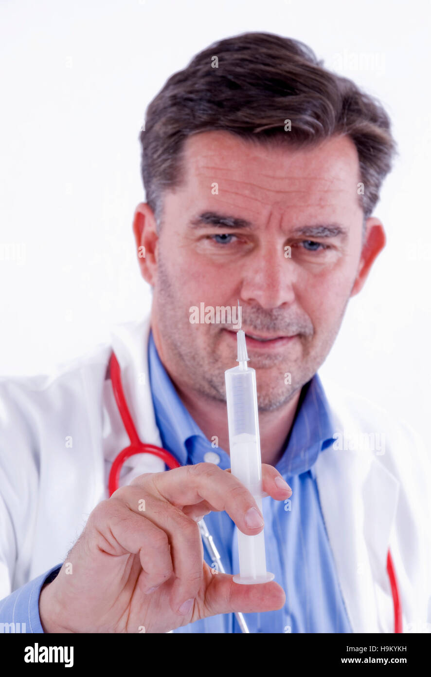 Doctor with a syringe Stock Photo - Alamy