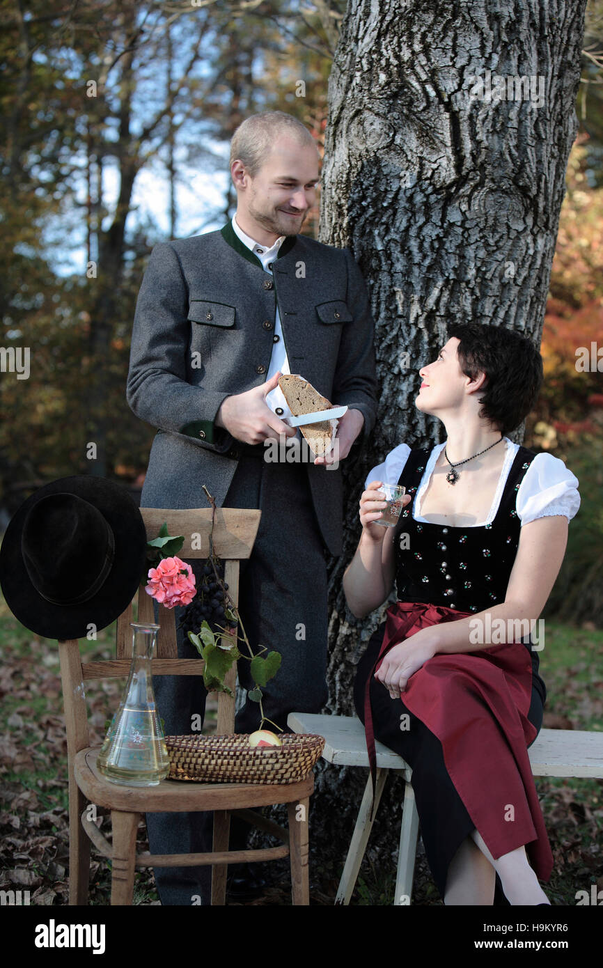 Couple wearing traditional, styrian costumes in autumn Stock Photo - Alamy