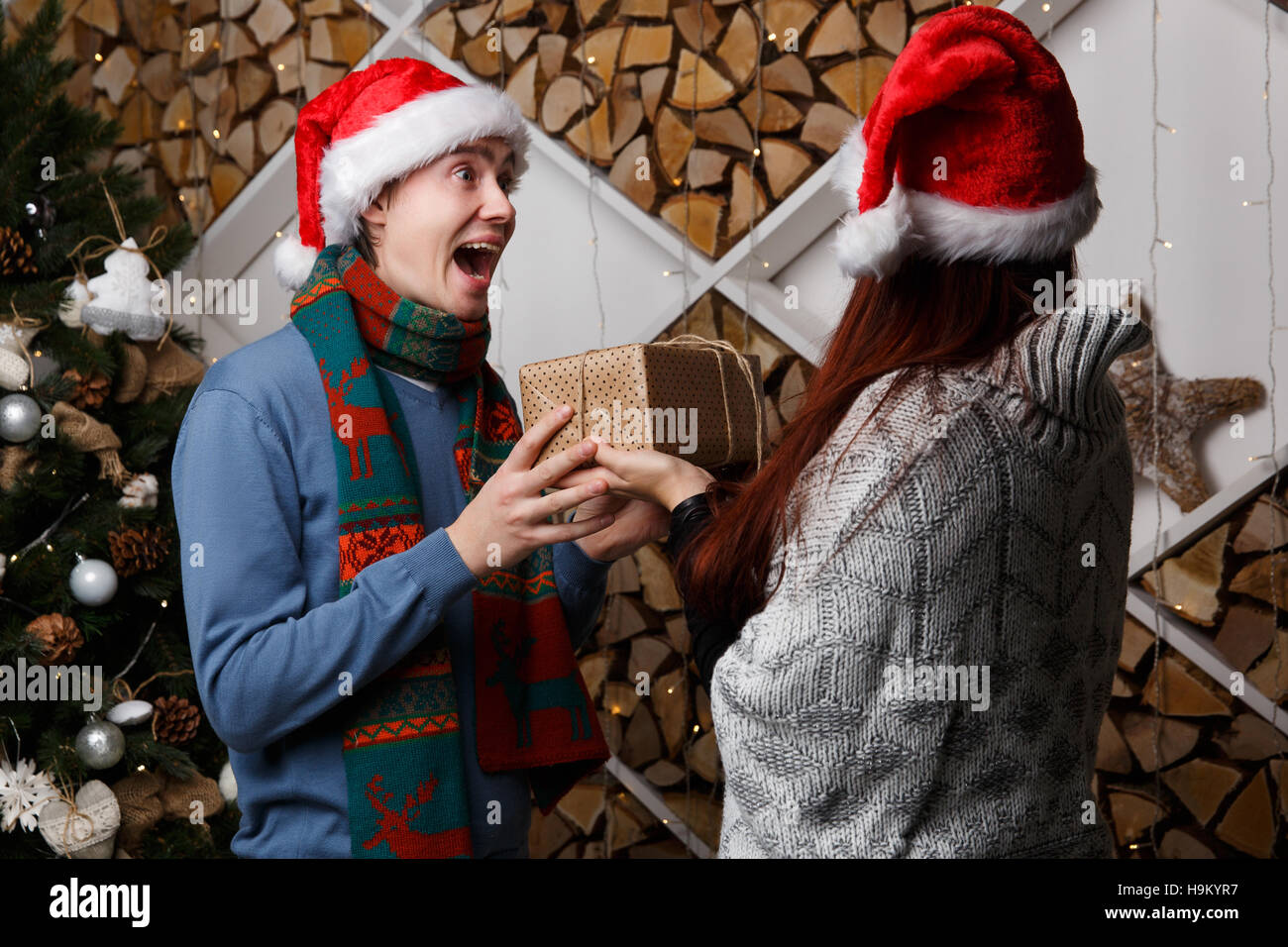 Guy with present from girl Stock Photo - Alamy