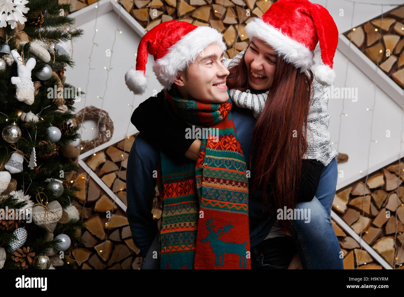 Girl hugging boyfriend at tree Stock Photo - Alamy