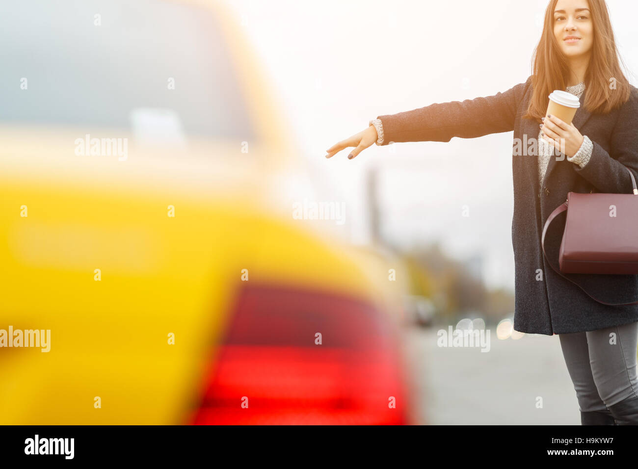 Woman on road stop taxi Stock Photo - Alamy