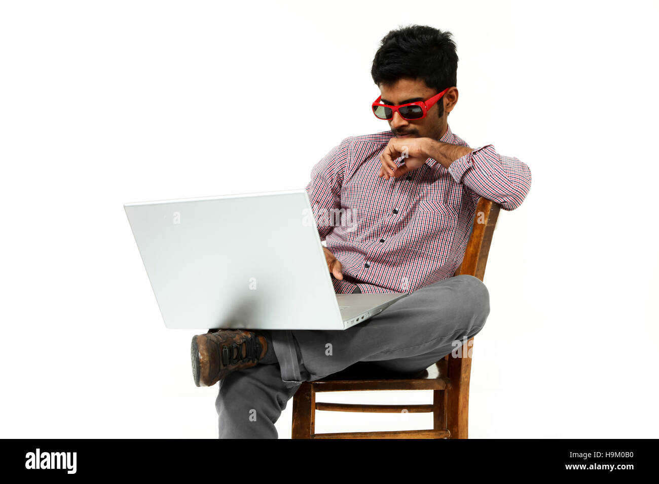 portrait of young man with his laptop, over white background Stock ...