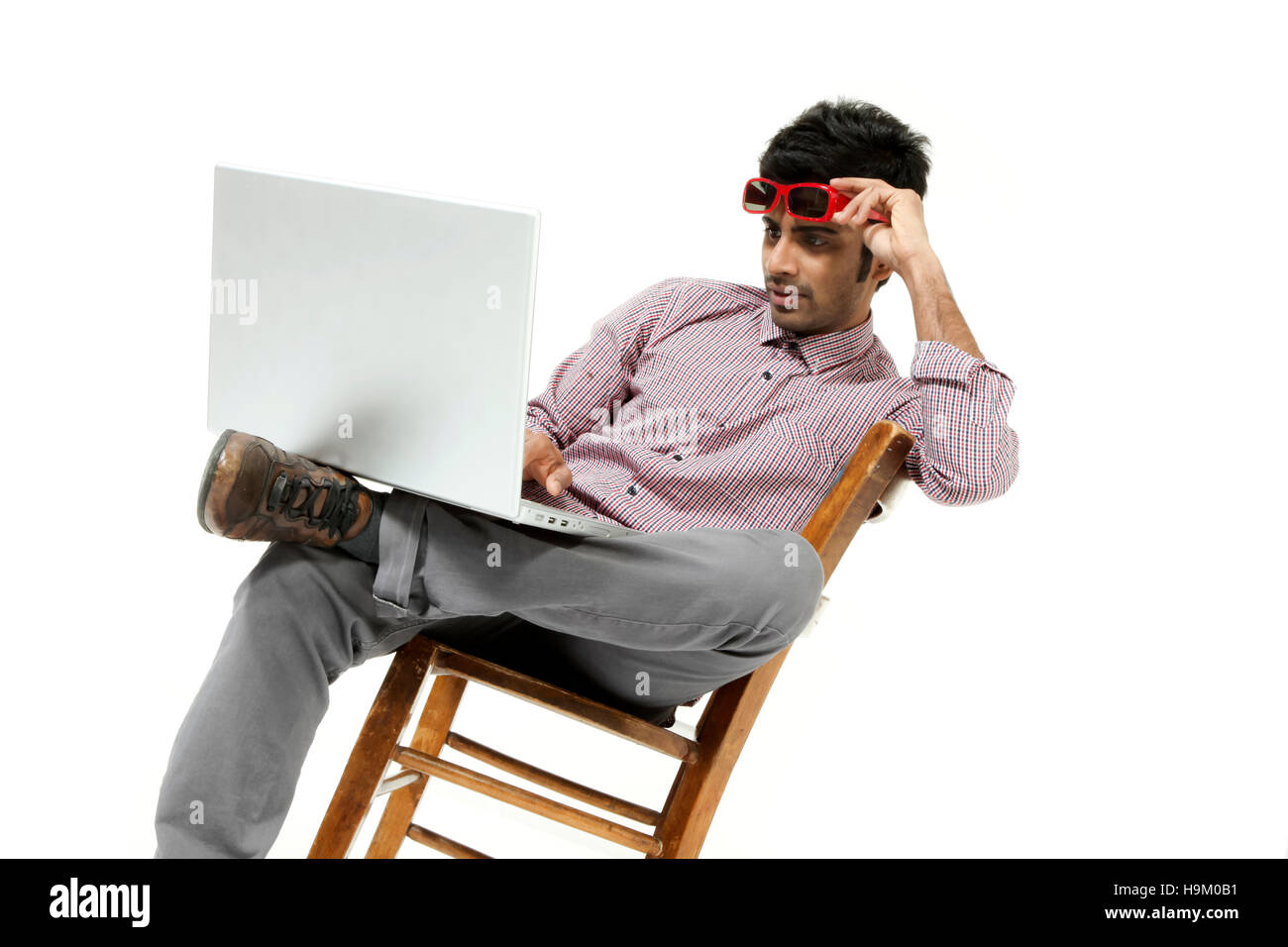portrait of young man with his laptop, over white background Stock ...