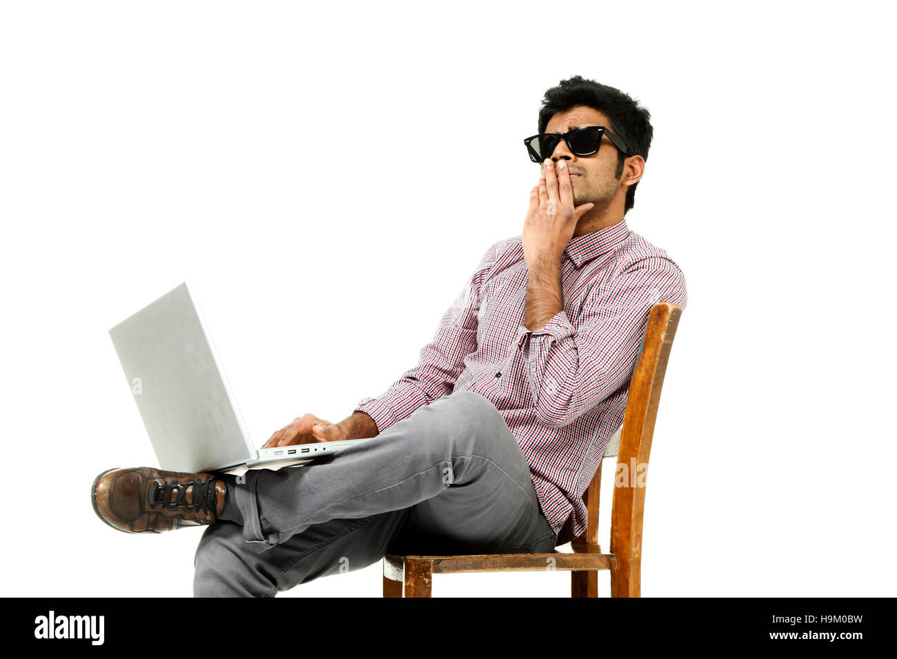 portrait of young man with his laptop, over white background Stock ...