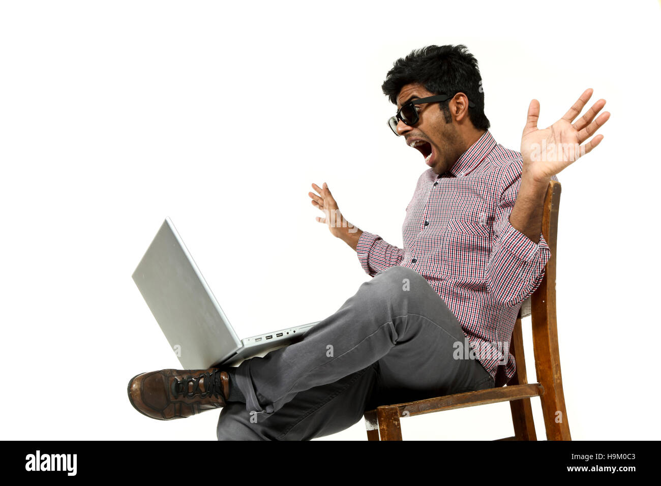portrait of young man with his laptop, over white background Stock ...