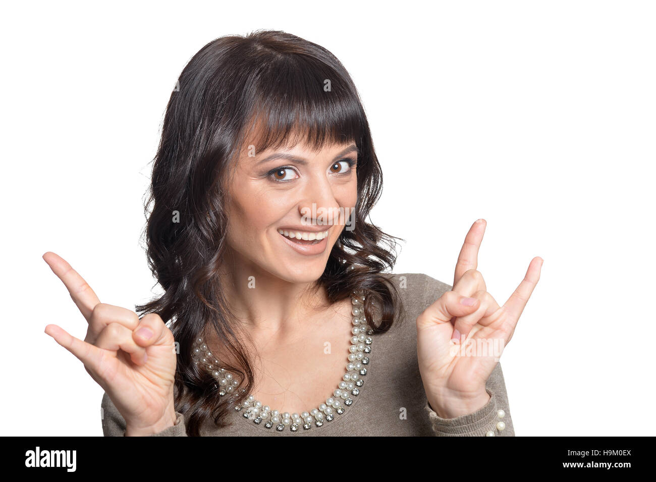 Woman shows rock gesture Stock Photo - Alamy