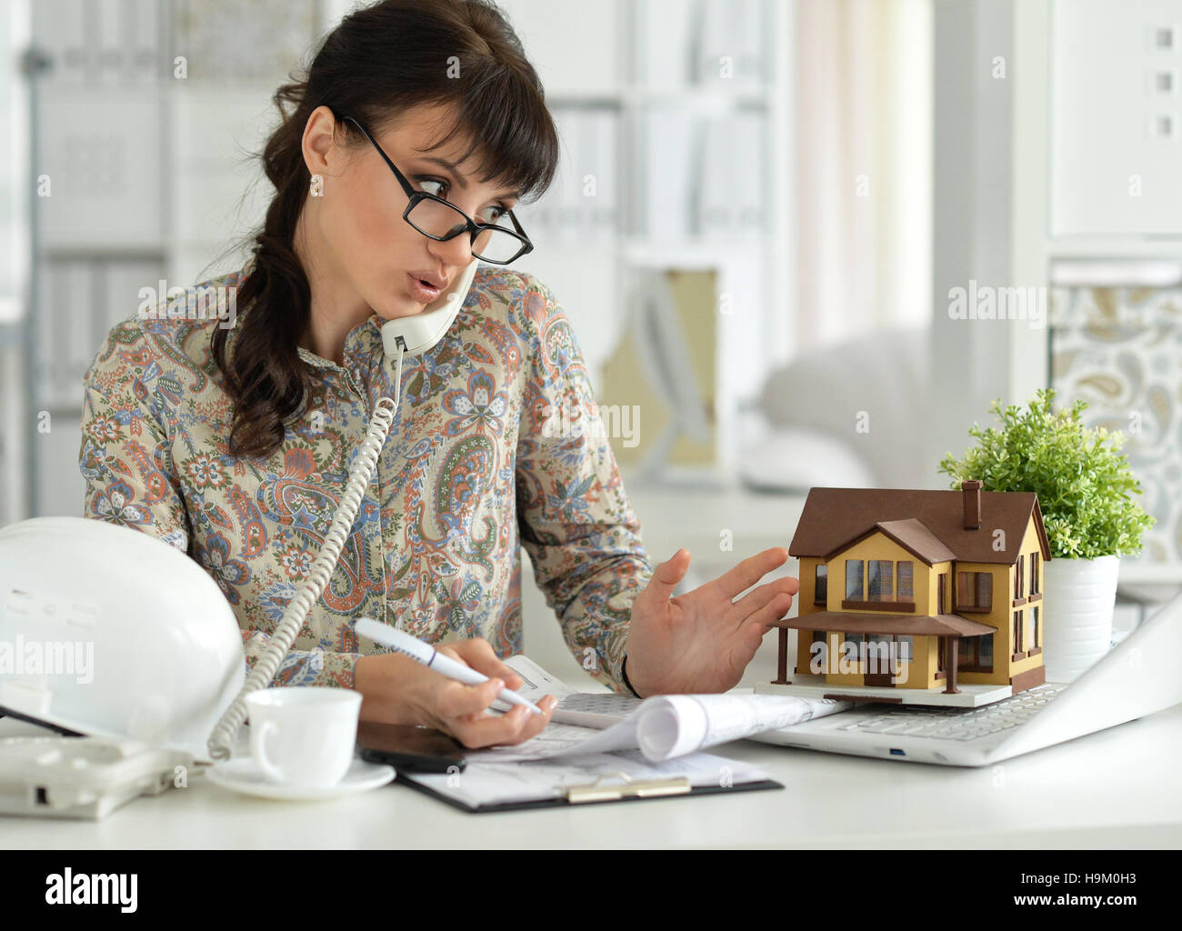 Female architect working Stock Photo - Alamy