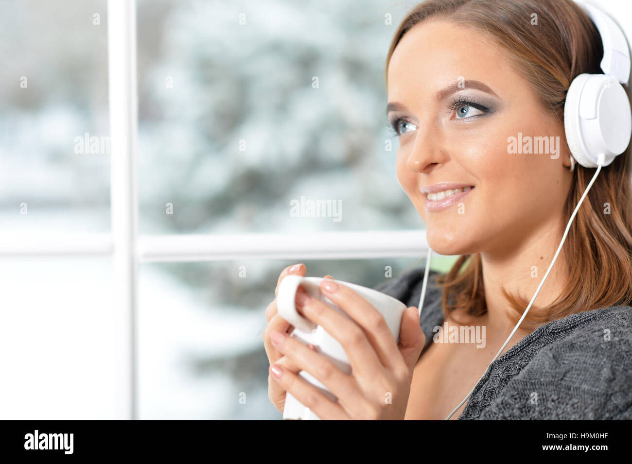 Girl drinking tea Stock Photo - Alamy