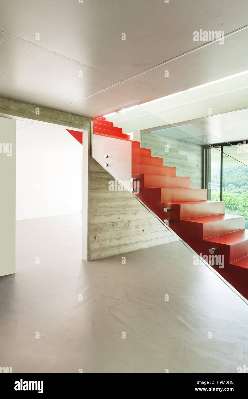 Interior, red staircase in modern villa Stock Photo - Alamy