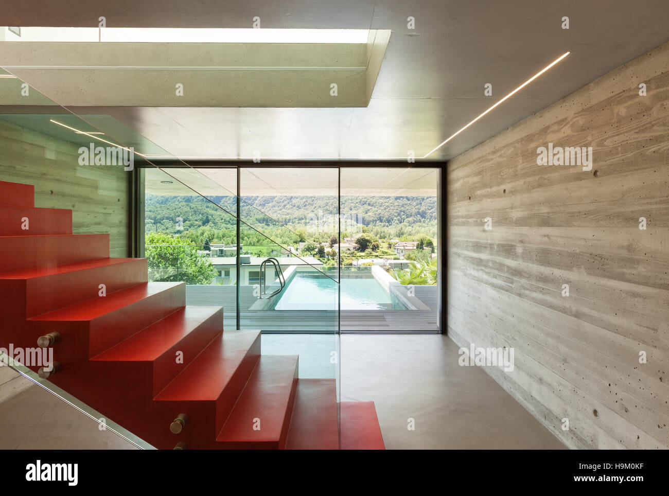Interior, red staircase in modern villa Stock Photo - Alamy