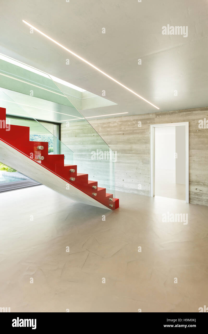 Interior, red staircase in modern villa Stock Photo - Alamy