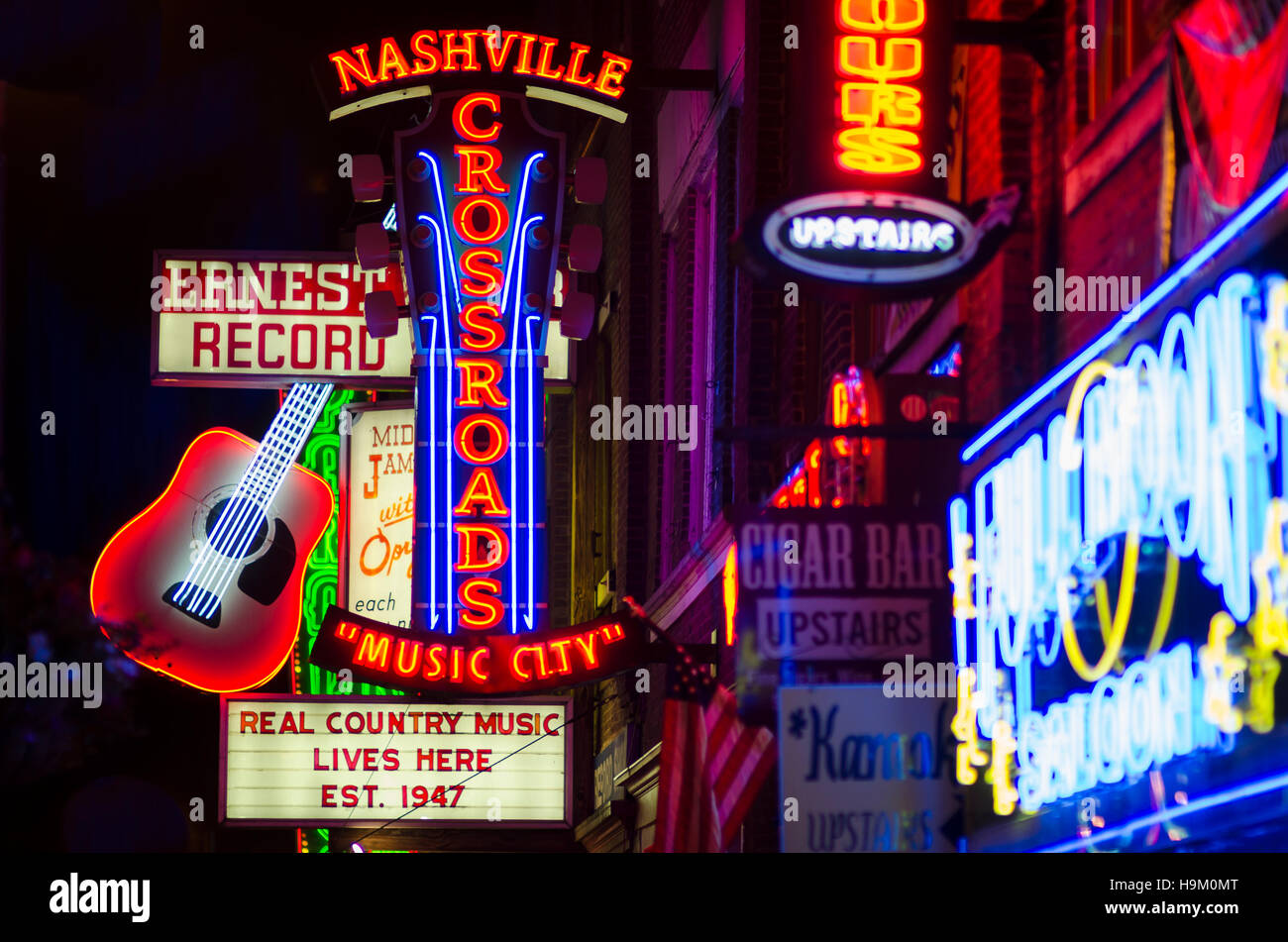 NASHVILLE - JULY 10, 2014: Bright neon signs of the city's honky tonk ...