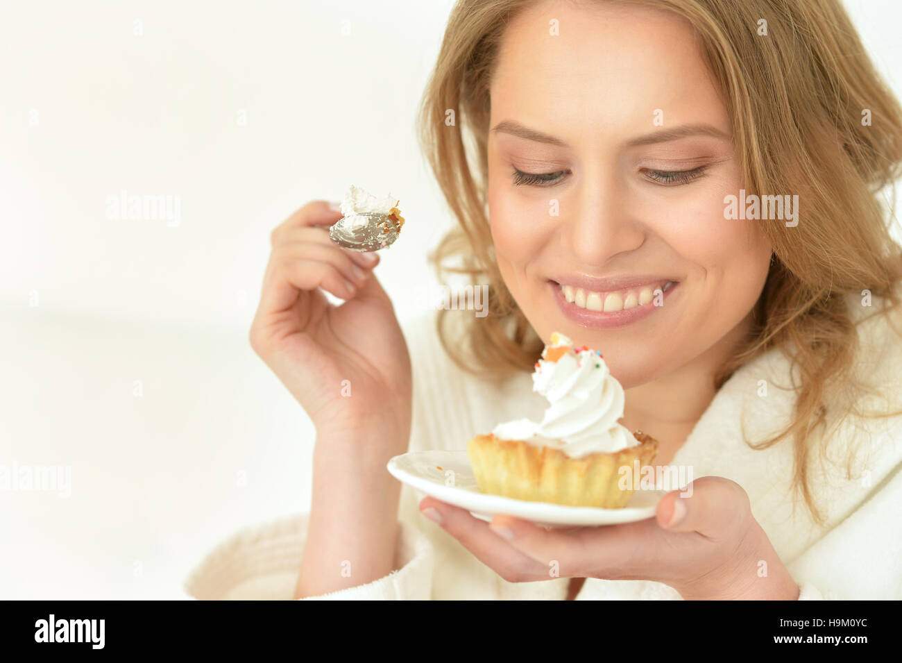 Young woman with cake Stock Photo - Alamy