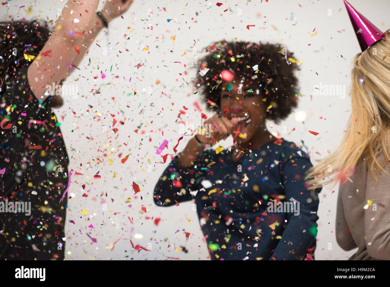 confetti party happy young people group celebrating new year eve while ...