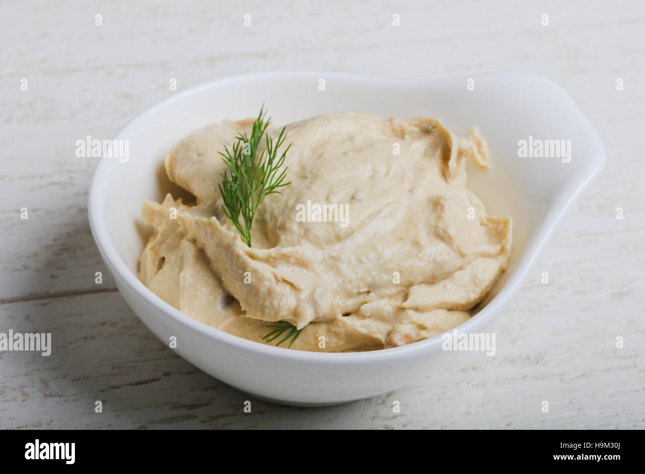 Arabic traditional cuisine - hummus with herbs and spices Stock Photo ...