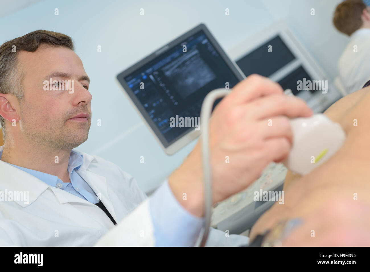 patient and doctor while performing ultrasound test Stock Photo - Alamy