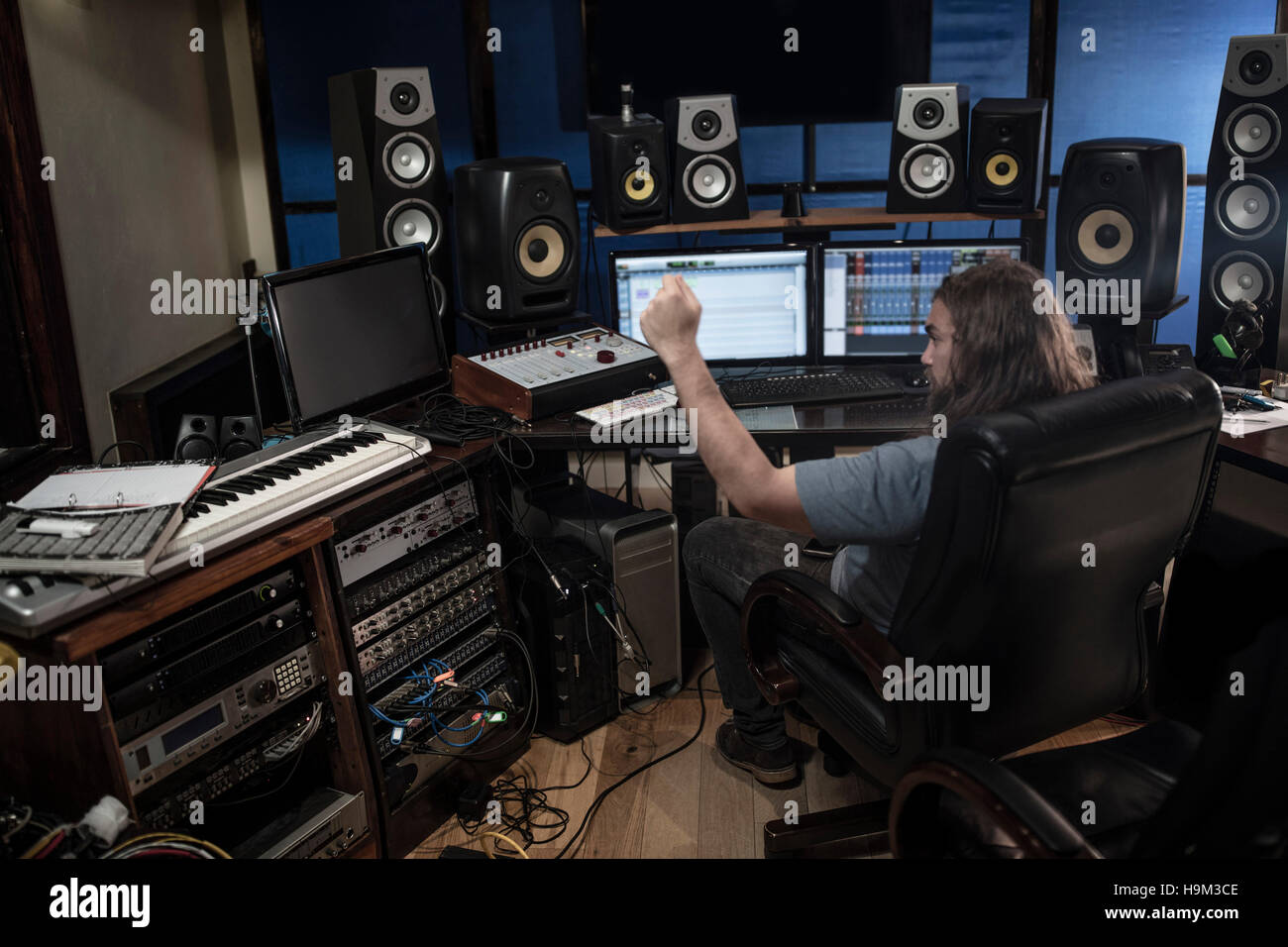 Audio engineer working in recording studio Stock Photo - Alamy
