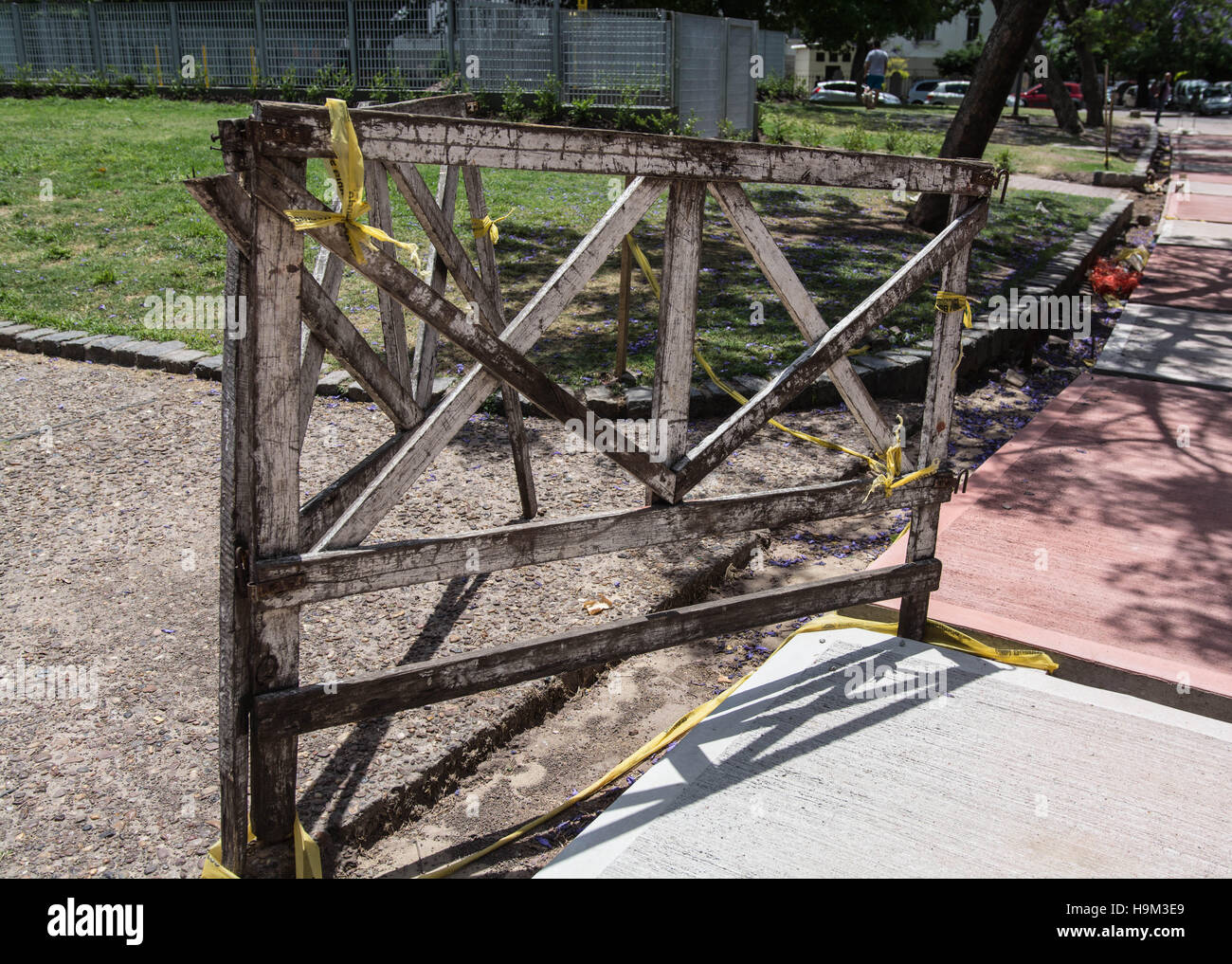 Security wooden barrier in the sidewalk Stock Photo - Alamy