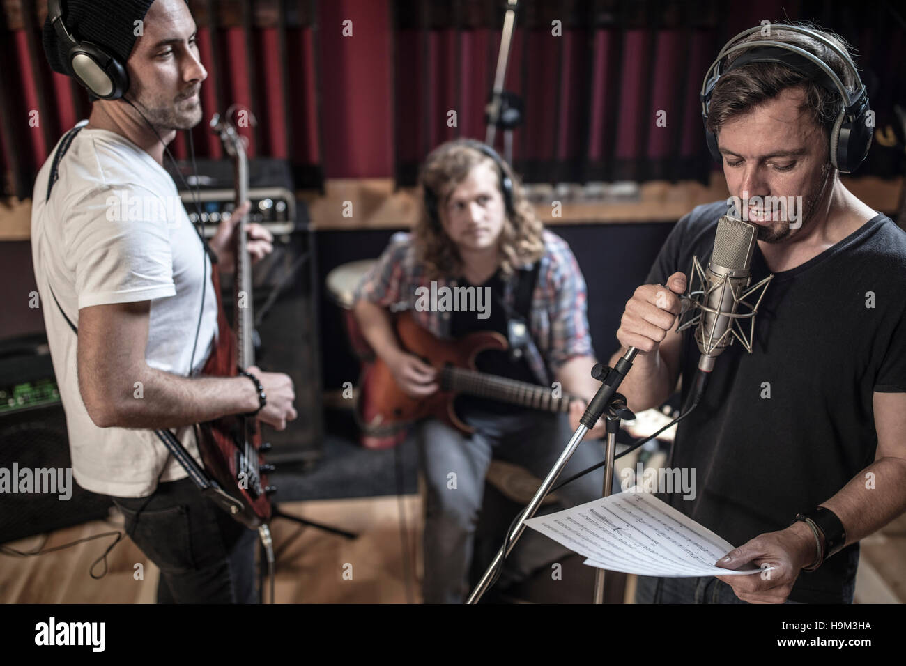 Band rehearsal in recording studio Stock Photo - Alamy