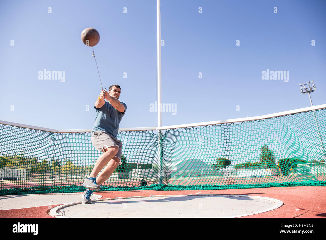 Athlete performing a hammer throw Stock Photo - Alamy