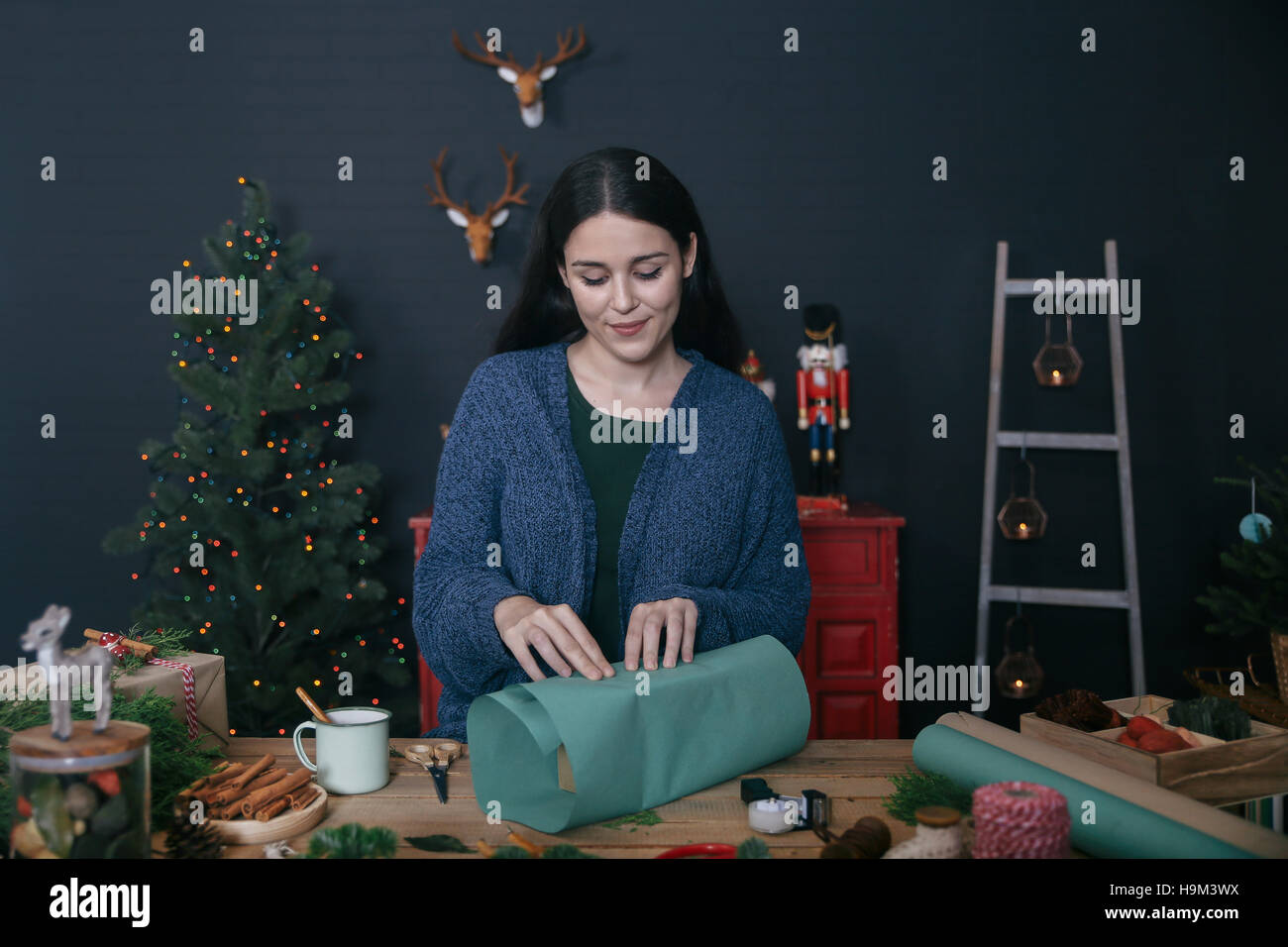Woman wrapping christmas gifts Stock Photo - Alamy