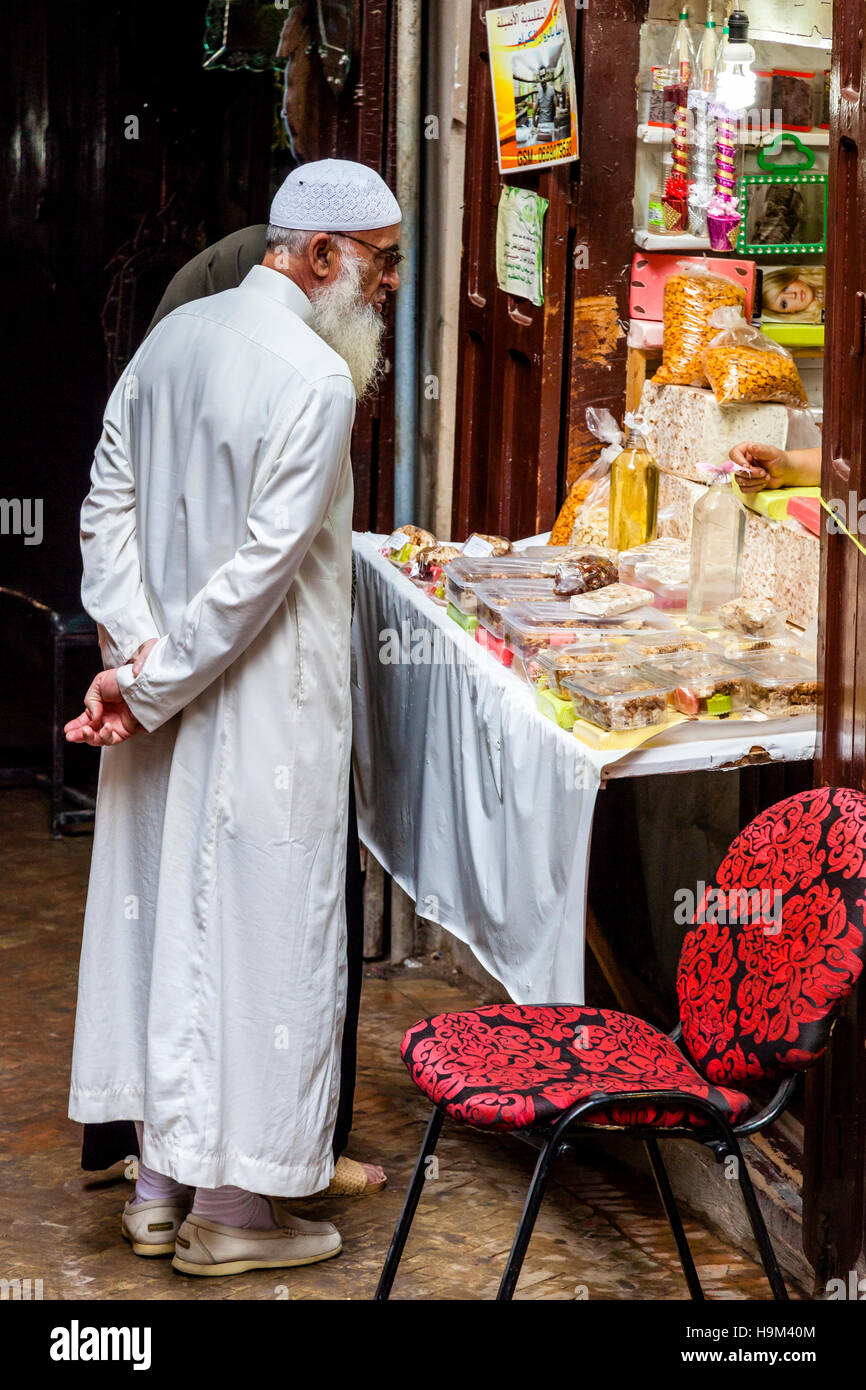 A Man and His Wife Buying Sweets and Candy From A Shop In The Medina ...