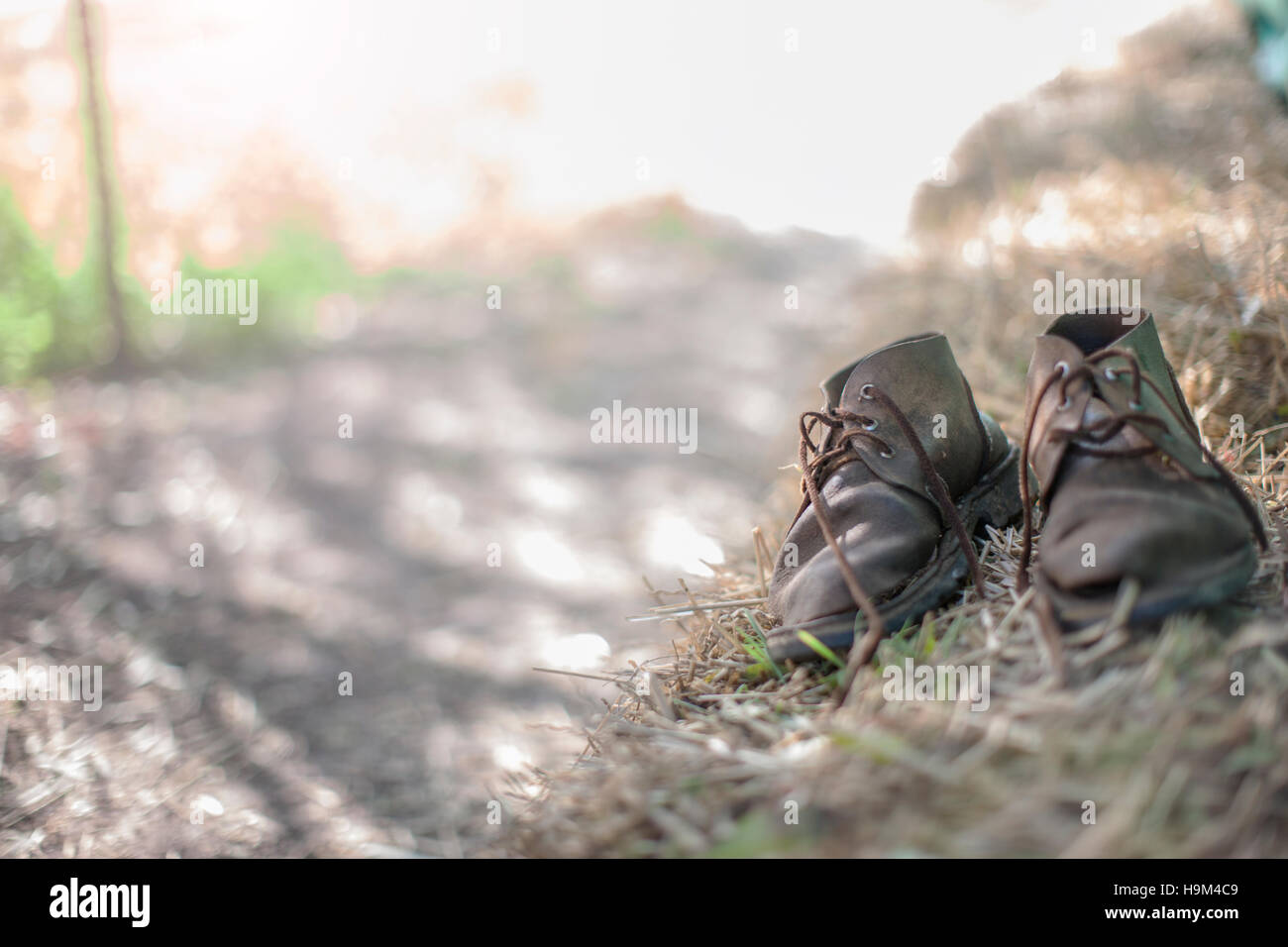 Pair of old boots on a farm Stock Photo - Alamy
