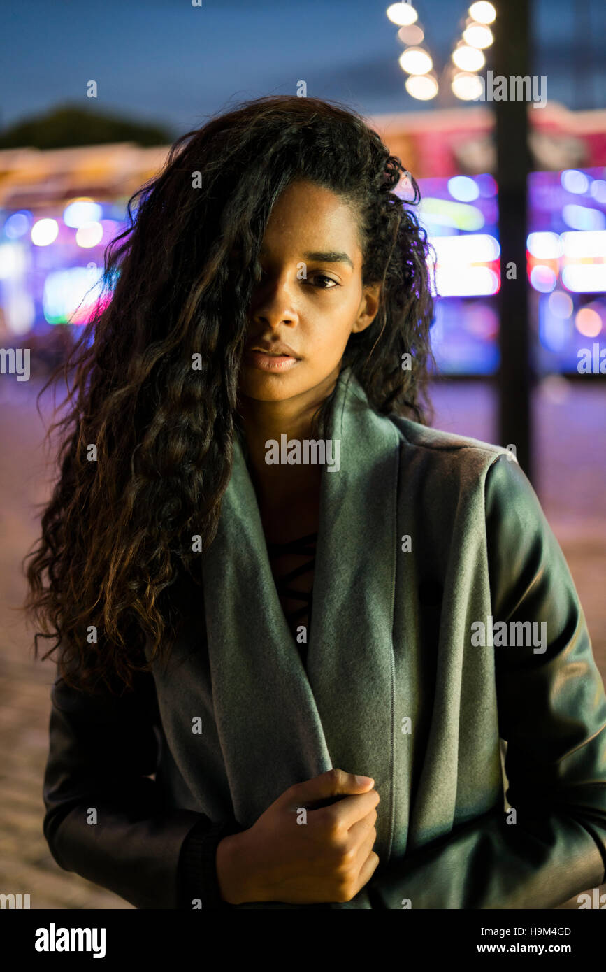 Portrait of a young woman on a funfair at night Stock Photo - Alamy