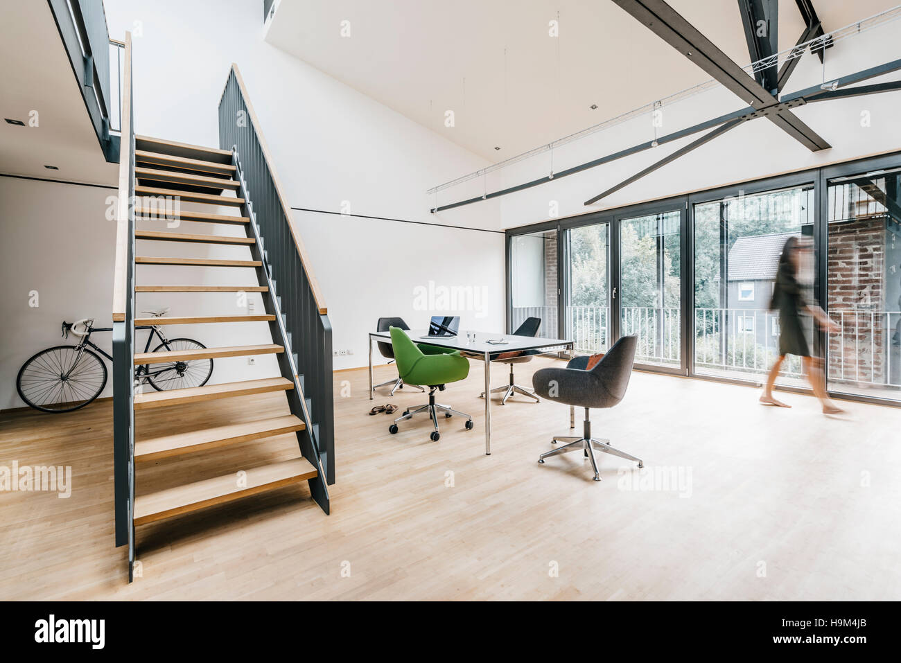 Woman on the move in office Stock Photo - Alamy