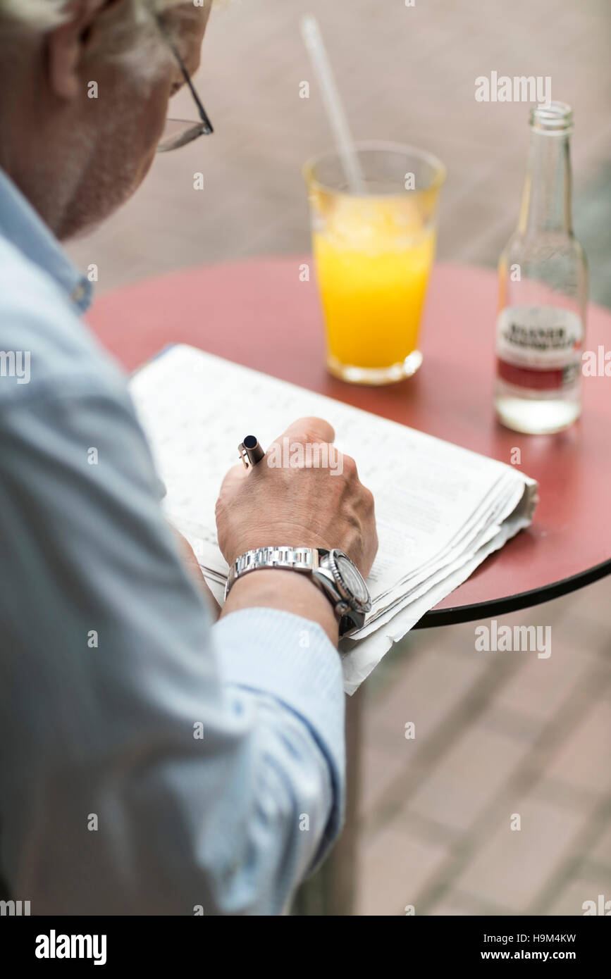 Person writing on newspaper hi-res stock photography and images - Alamy