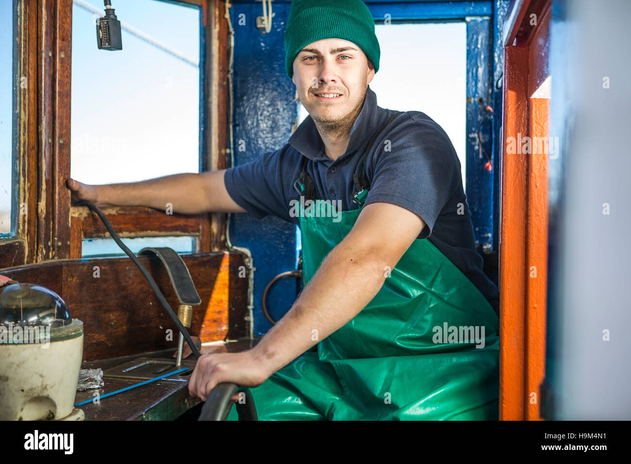 Fisherman working on trawler Stock Photo - Alamy