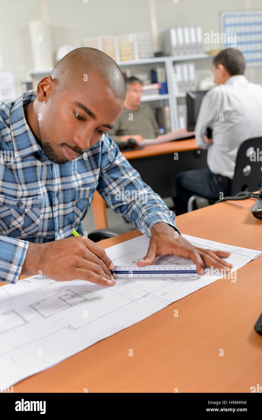 man measuring a blueprint Stock Photo - Alamy