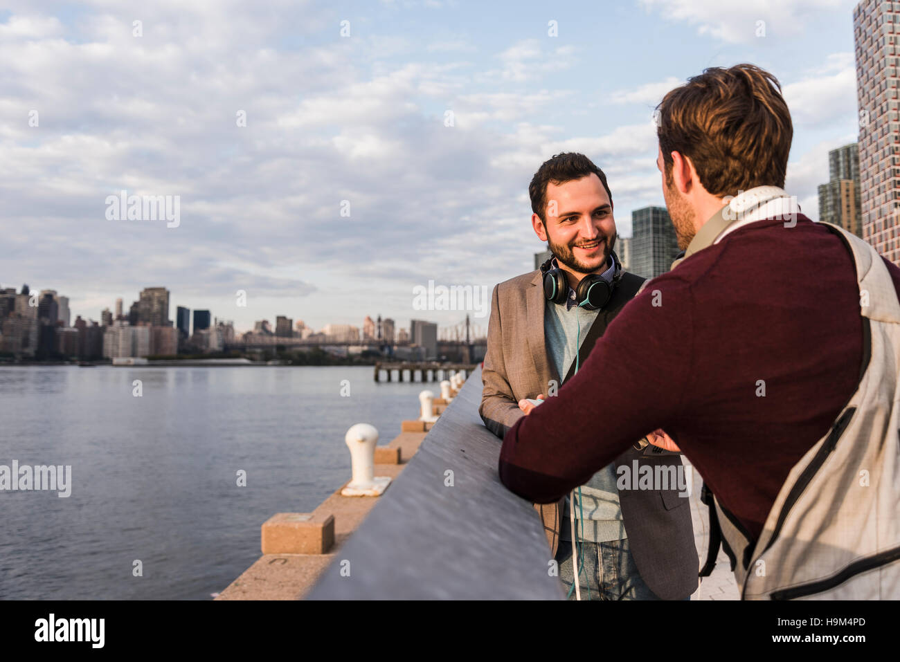 USA, New York City, two young men at East River Stock Photo - Alamy