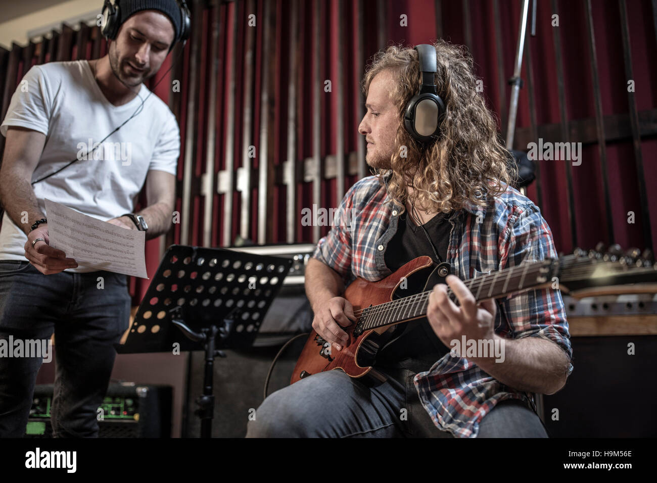Musicians in recording studio Stock Photo - Alamy