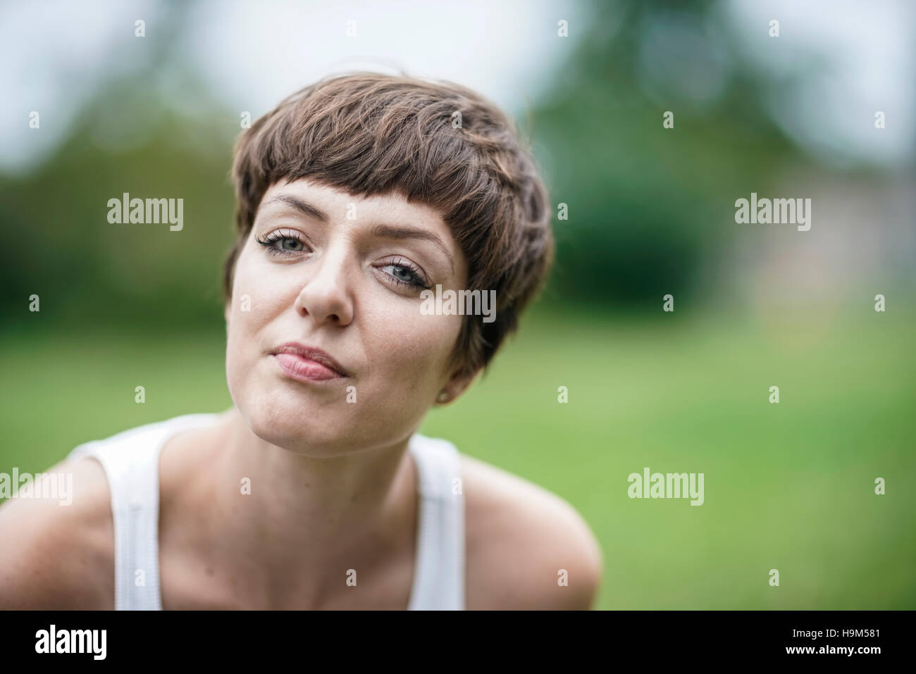 Portrait of asking young woman Stock Photo - Alamy