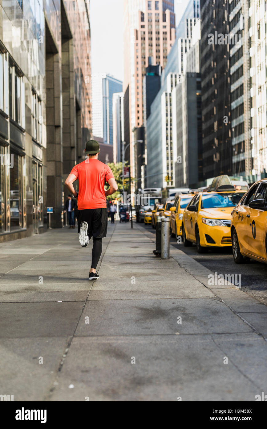 USA, New York City, man running in Manhattan Stock Photo - Alamy