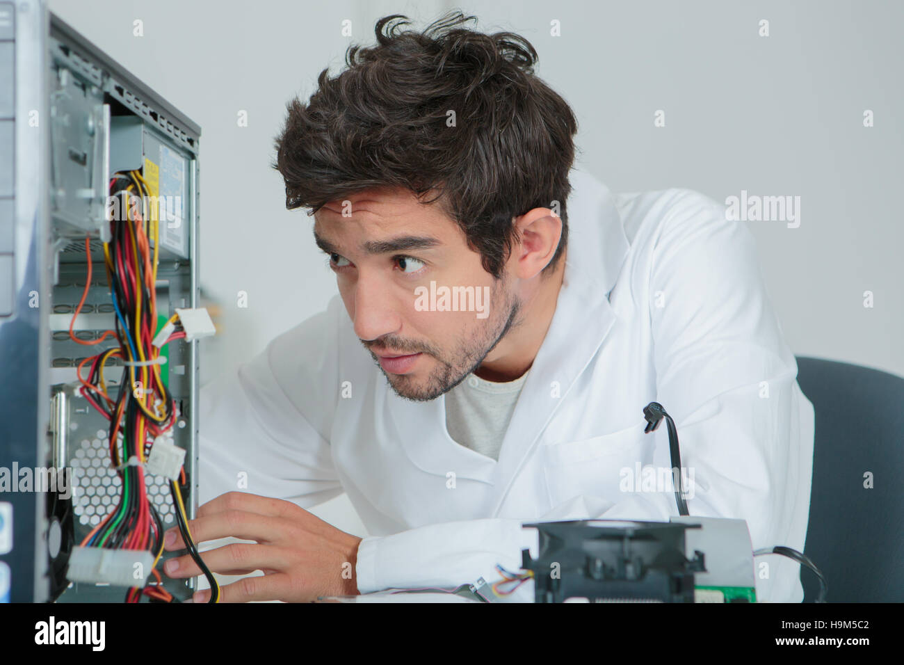 computer specialist checking central unit Stock Photo - Alamy