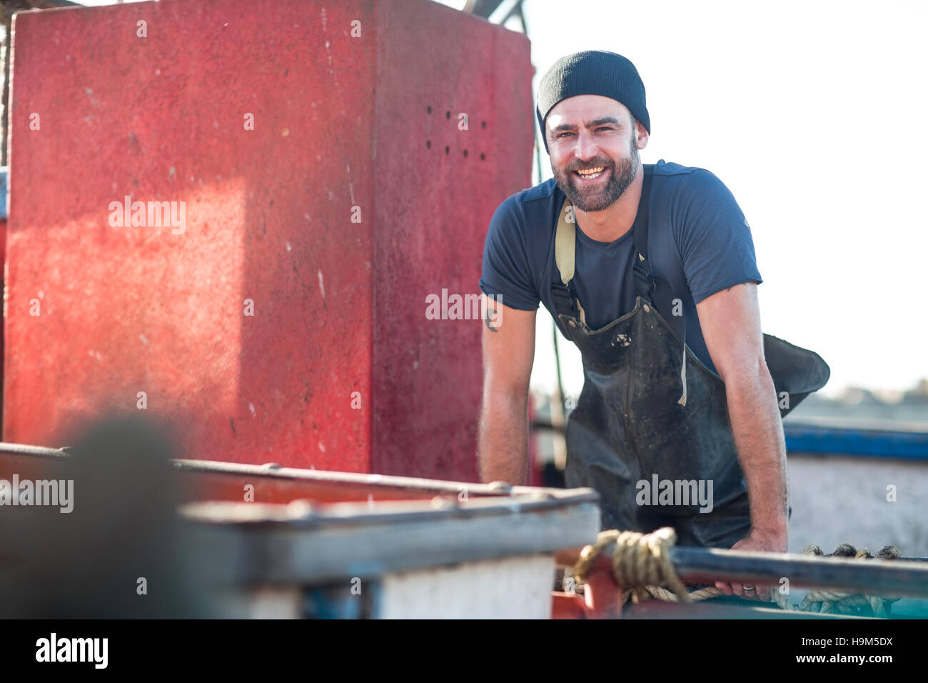 Fisherman working on trawler Stock Photo - Alamy