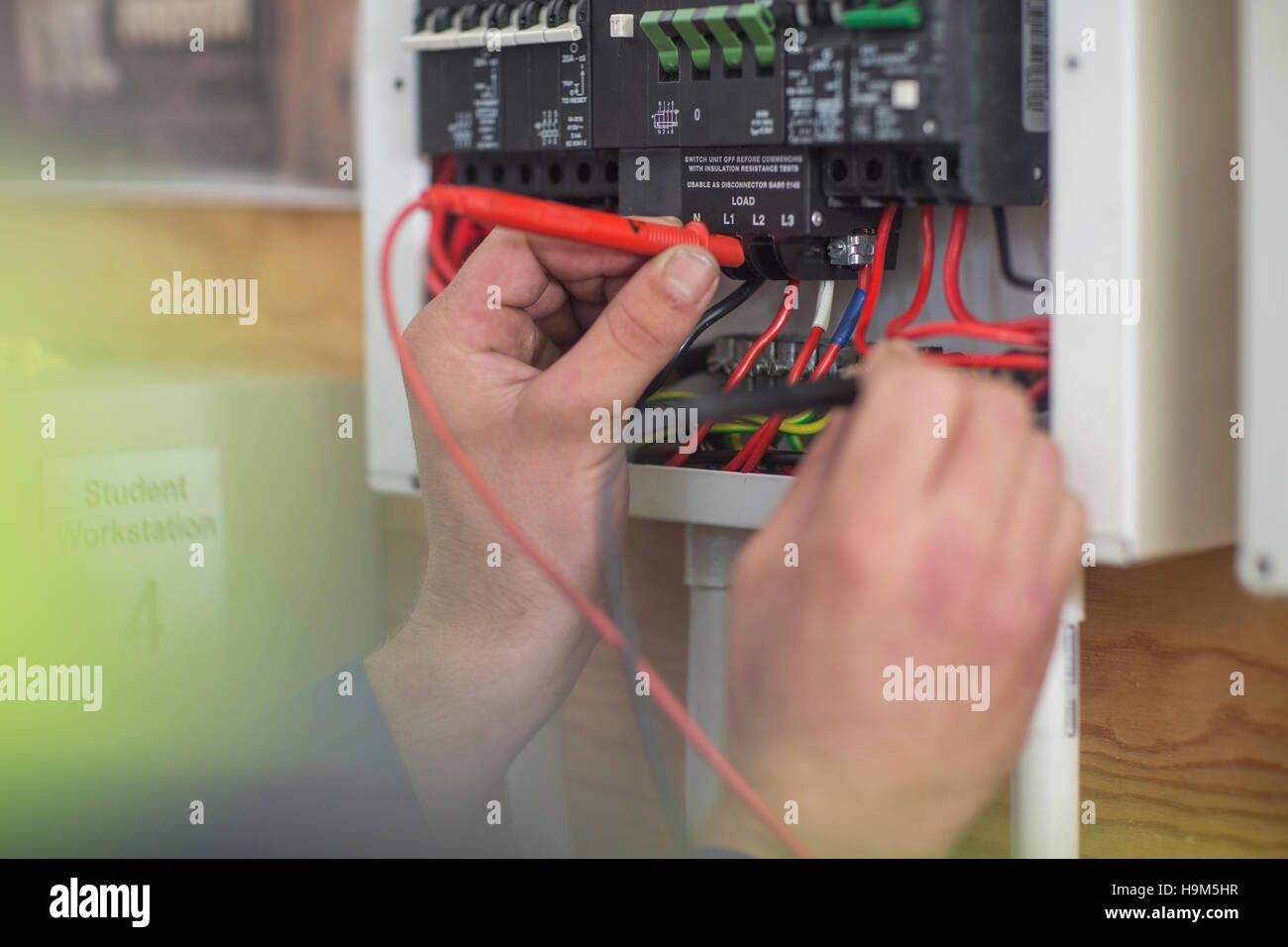 Electrician working on electrical panel Stock Photo - Alamy