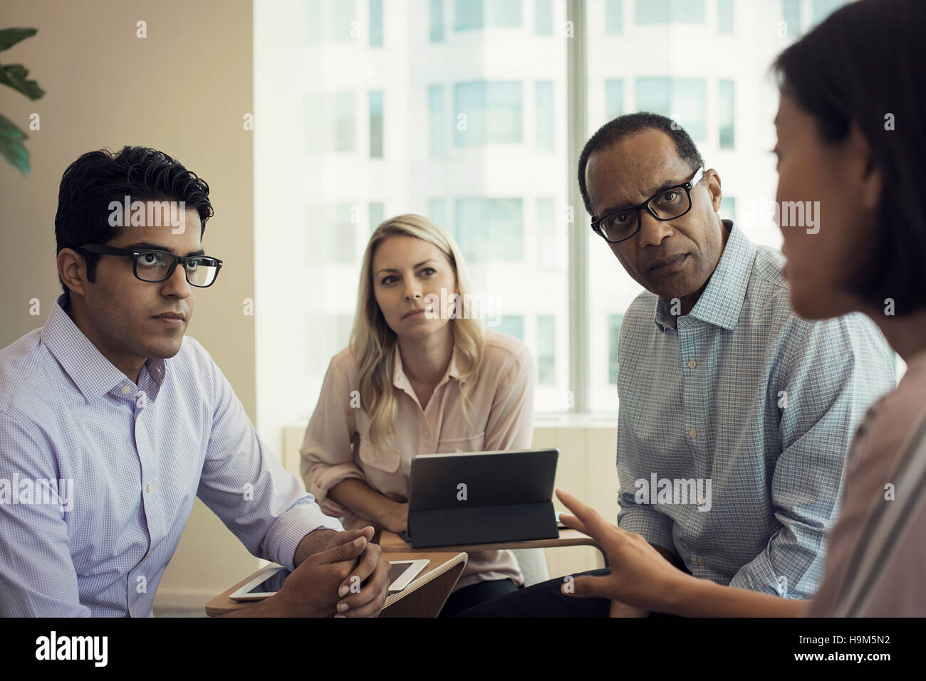 Business people in meeting having interesting discussion Stock Photo ...