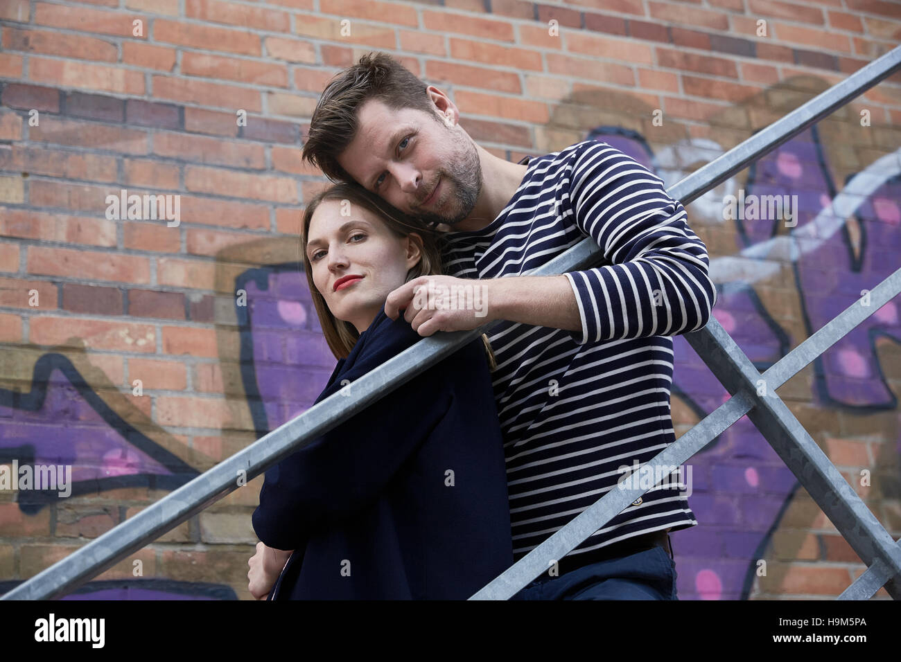 Portrait of couple on stairs outdoors Stock Photo - Alamy
