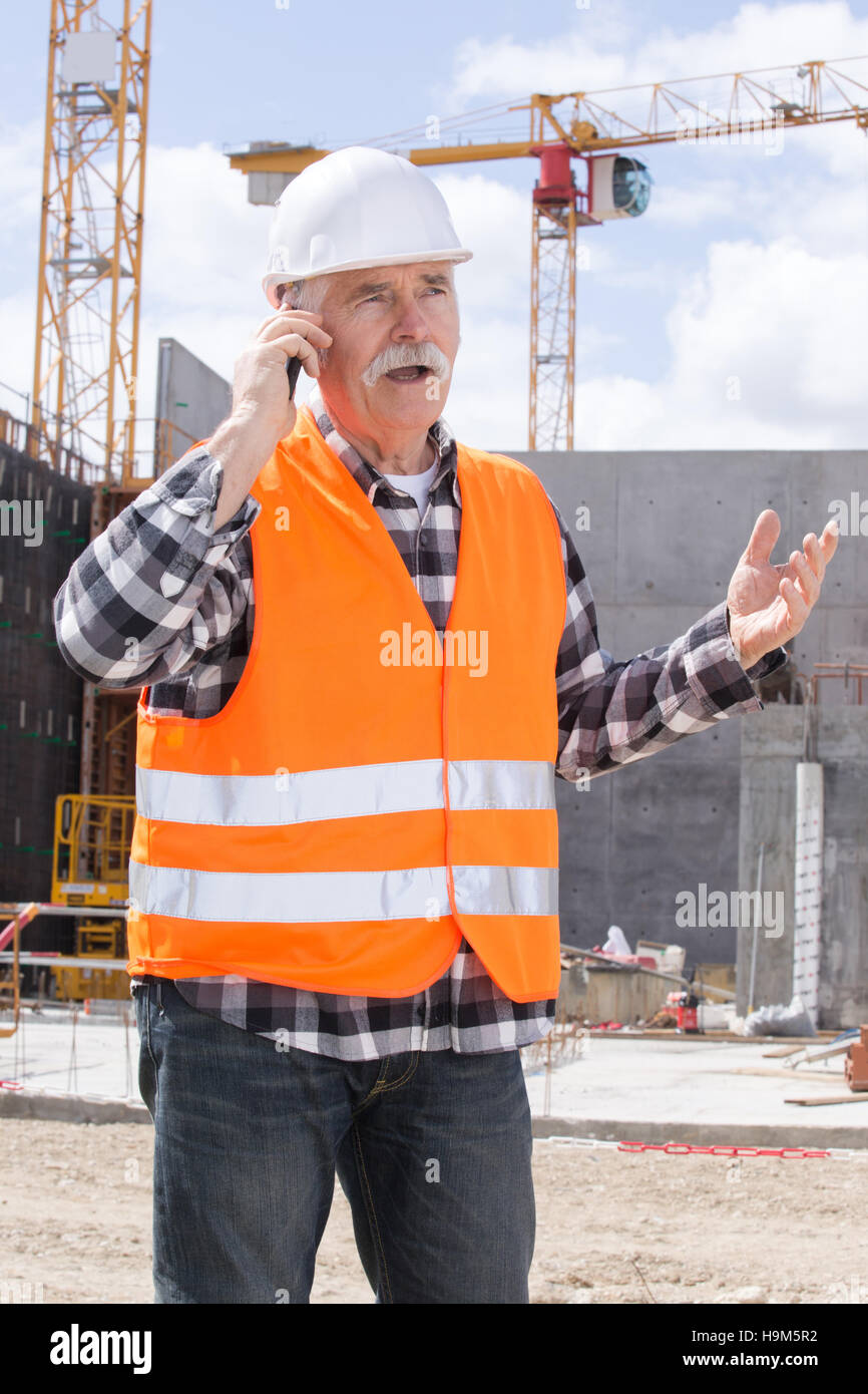 engineer builder at construction site talking on the phone Stock Photo ...