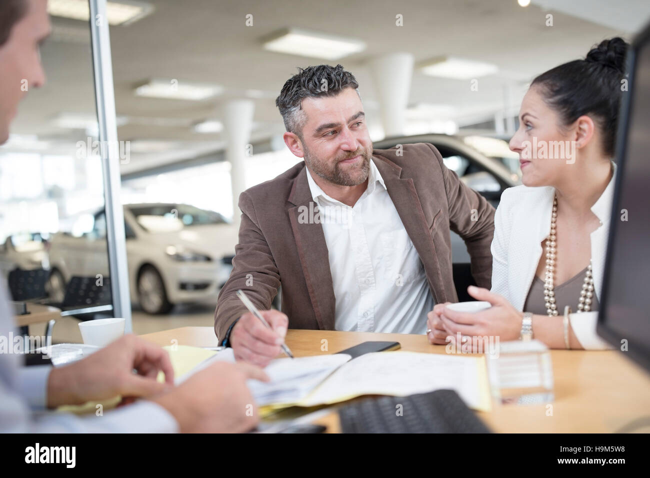 Car salesman sitting desk in hi-res stock photography and images - Alamy