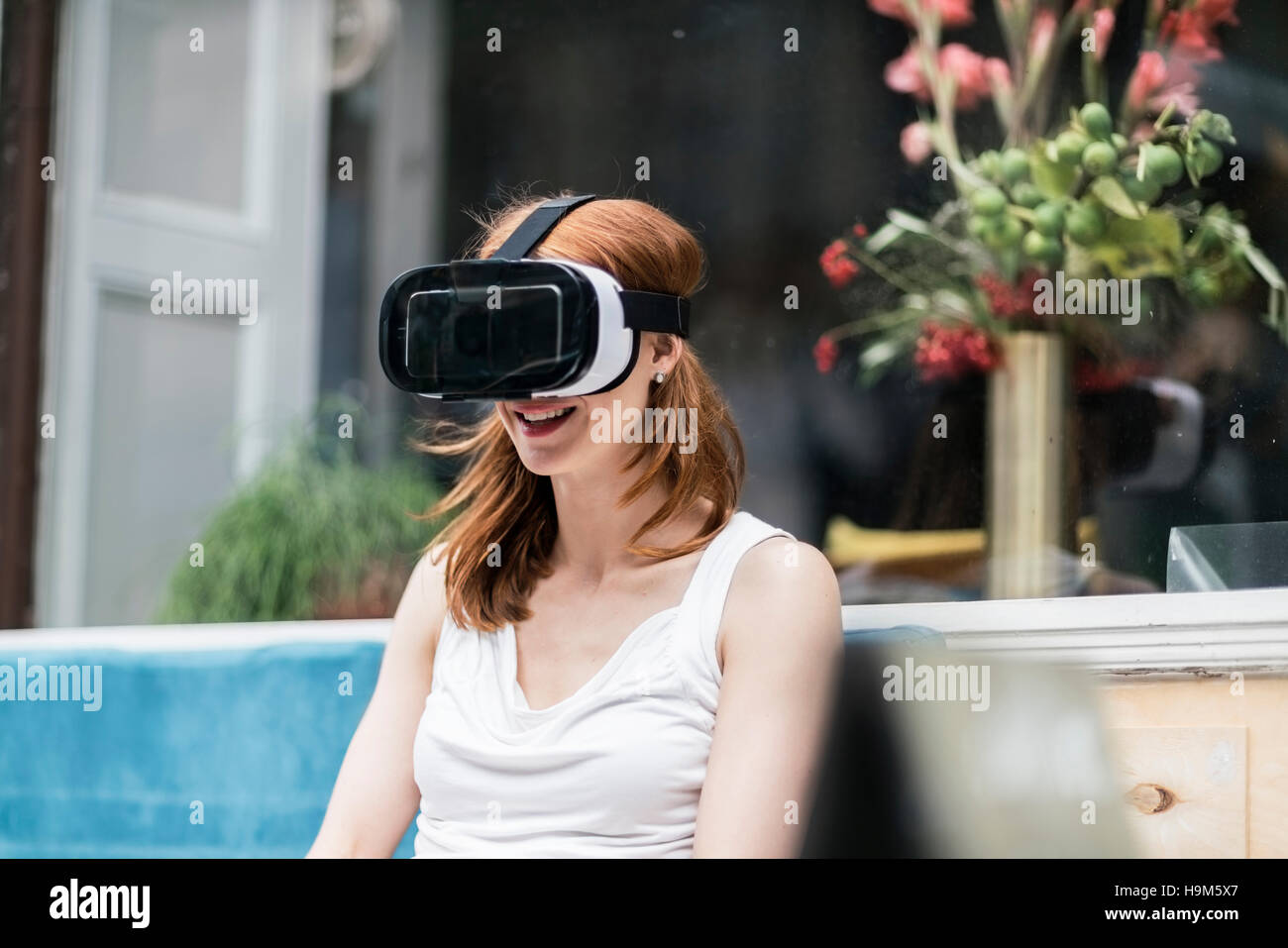 Redheaded woman wearing Virtual Reality Glasses Stock Photo - Alamy