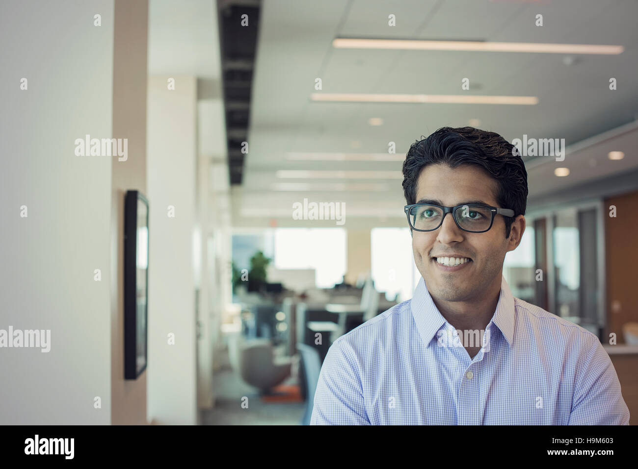 Indian man in office, portrait Stock Photo - Alamy