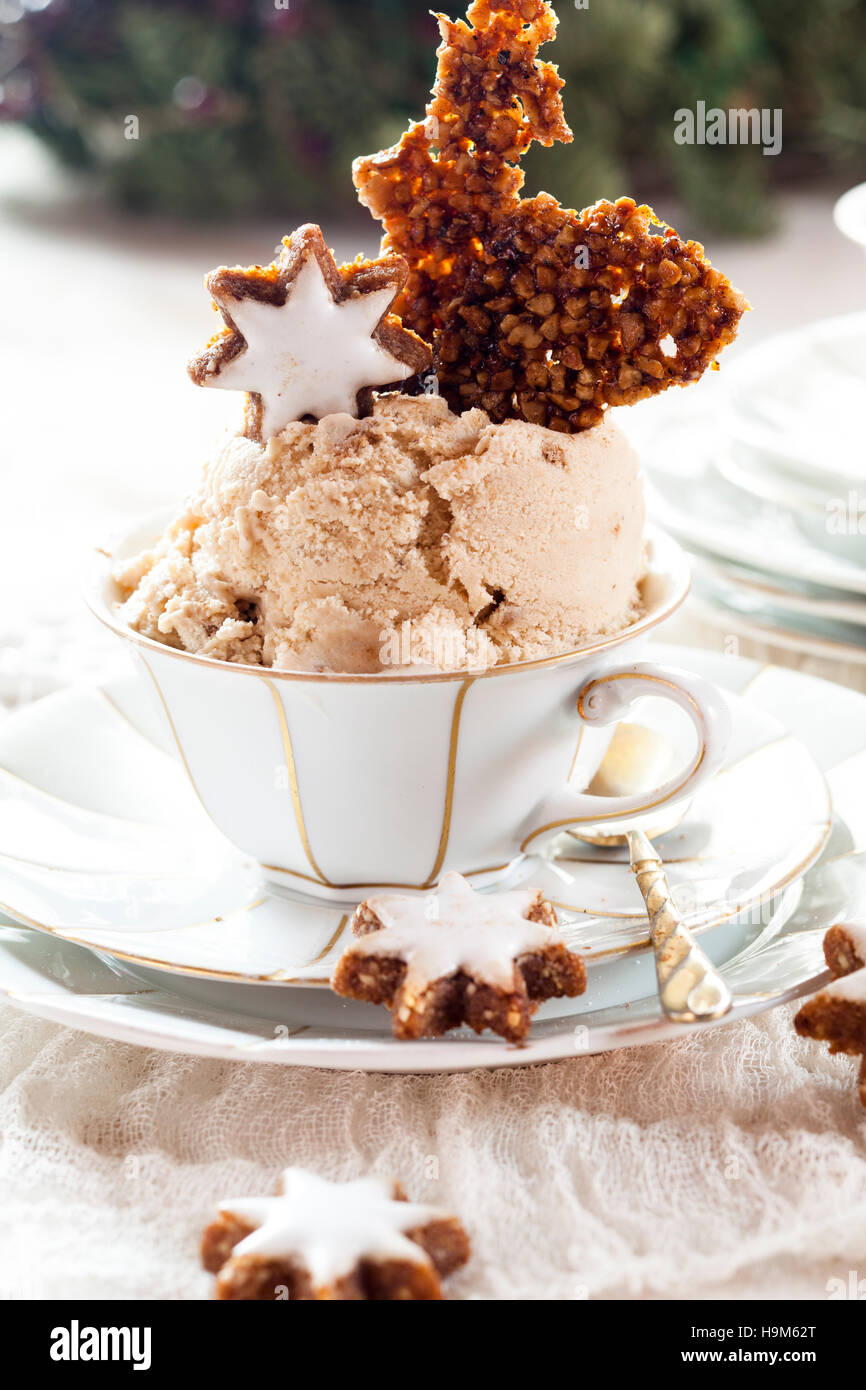 Tea cup of cinnamon star ice cream with caramelized nuts Stock Photo ...