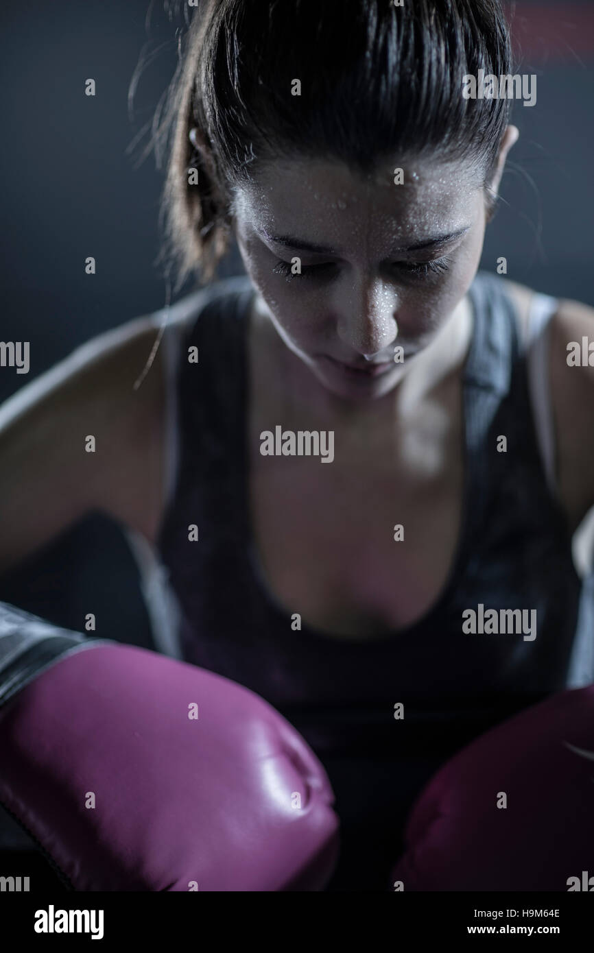 Female boxer looking down Stock Photo - Alamy