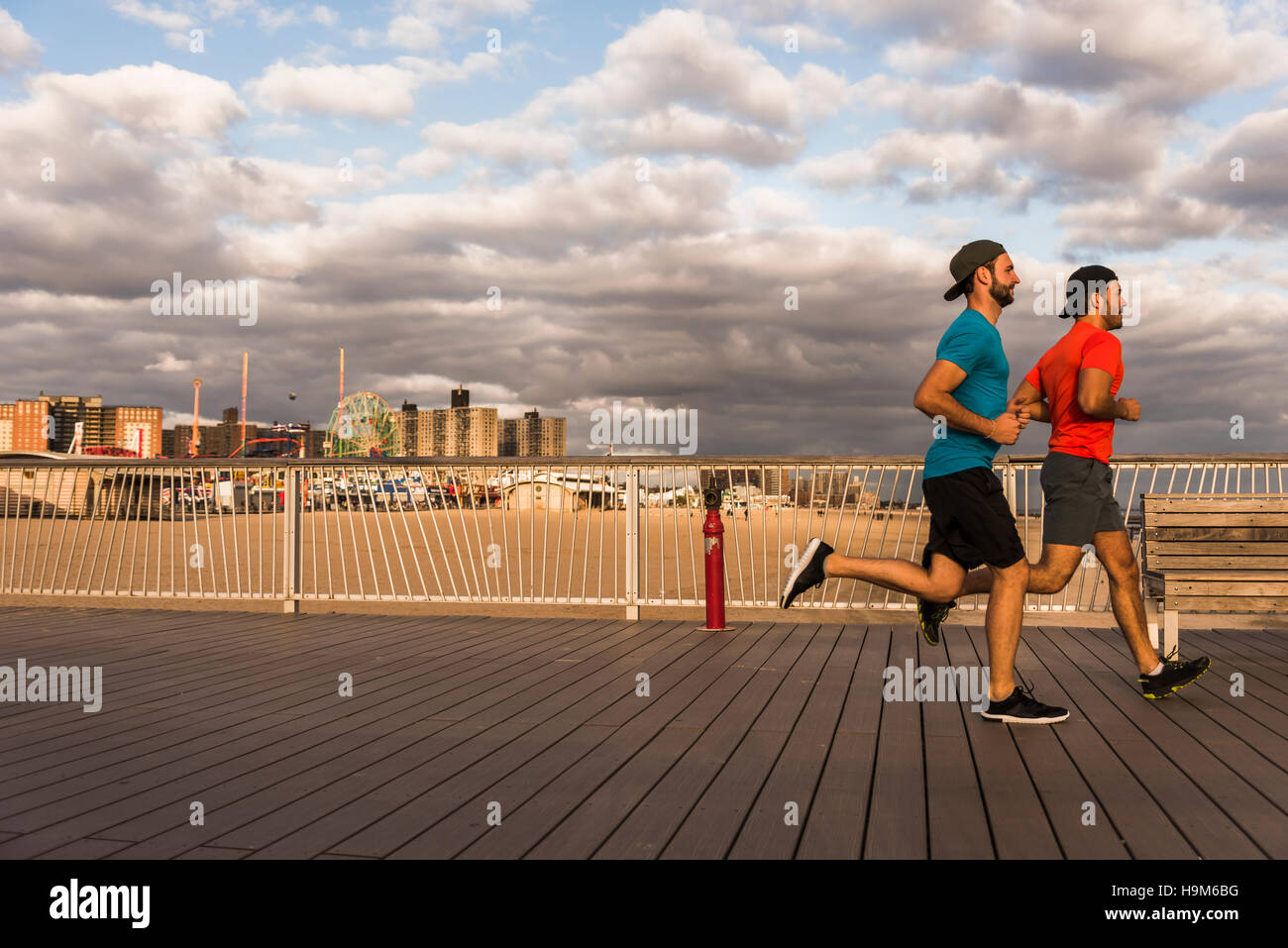 USA, New York City, two men running on Coney Island Stock Photo - Alamy