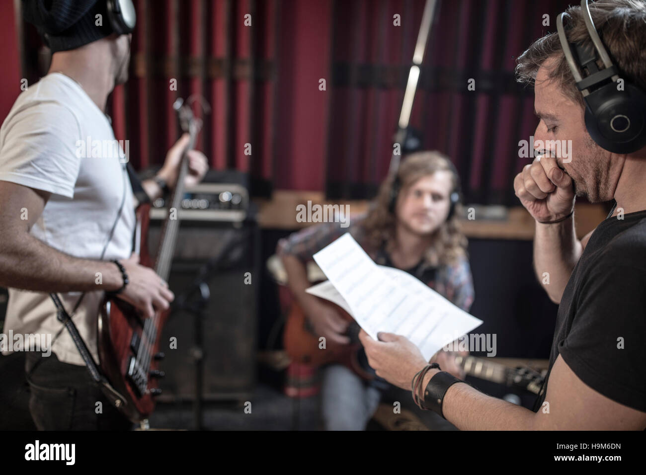 Band rehearsal in recording studio Stock Photo - Alamy